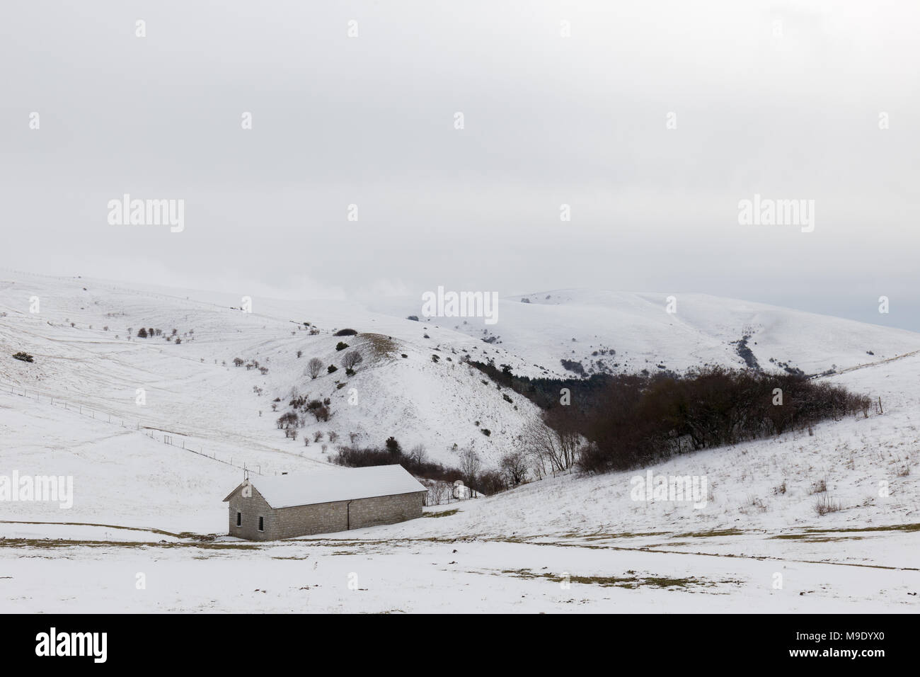 A small mountain retreat covered by snow on Mt. Subasio (Umbria, Italy ...