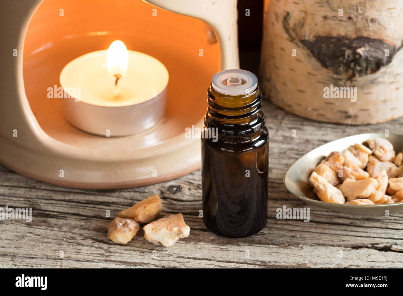A bottle of styrax benzoin essential oil with styrax benzoin resin and ...