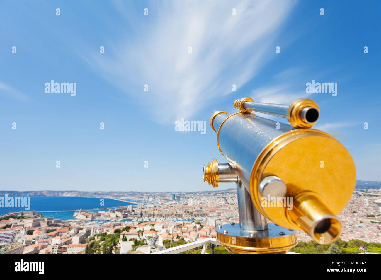 Brass telescope overlooking cityscape of Marseille Stock Photo - Alamy