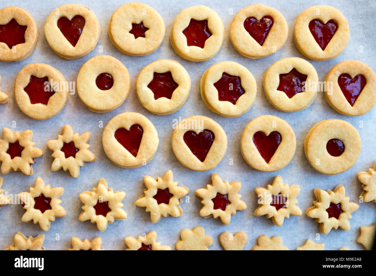 Traditional Linzer Christmas cookies filled with strawberry jam on ...