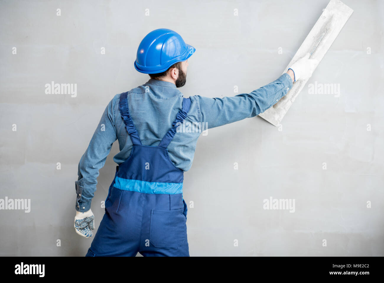 Plastering man wall back hi-res stock photography and images - Alamy