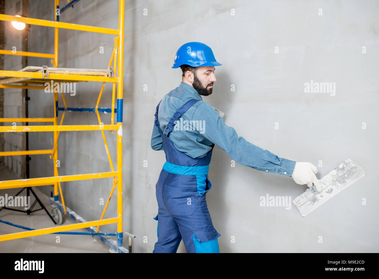Plasterer working indoors Stock Photo - Alamy