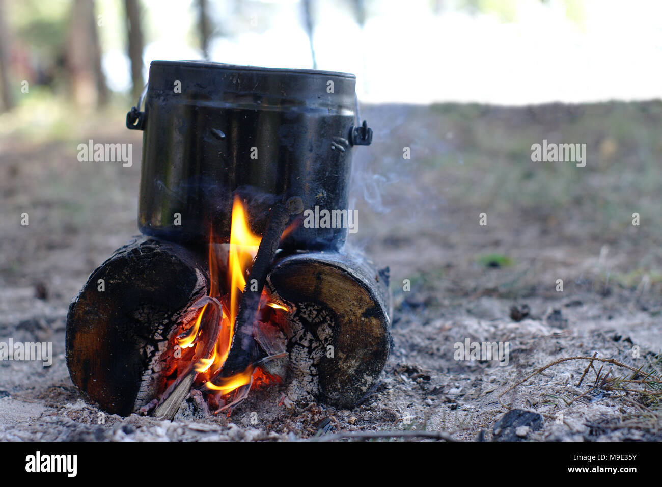 Tourist pot on the fire. Black pot are heating on the fire Stock Photo ...