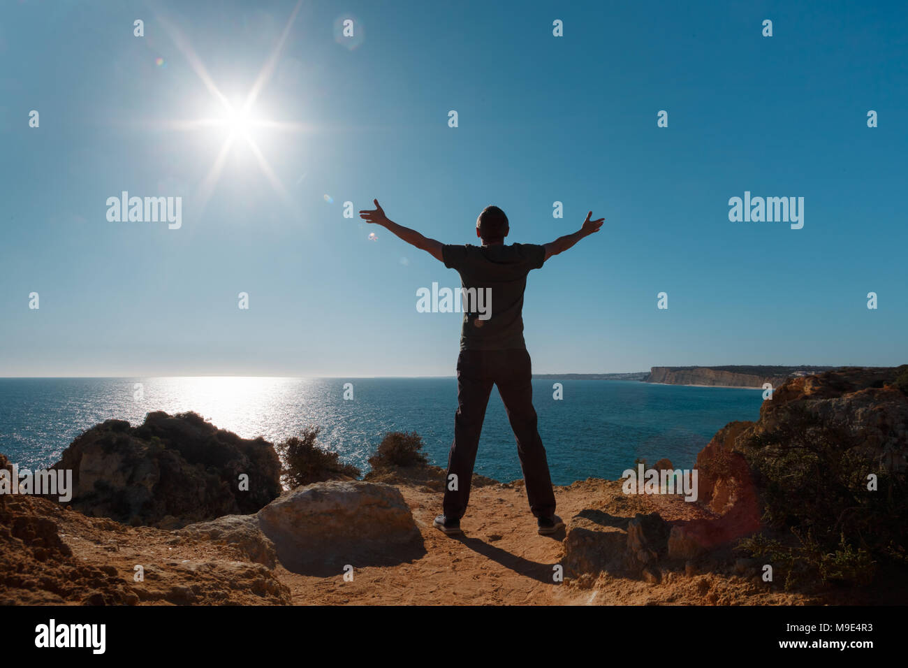 Person with arms raised hi-res stock photography and images - Alamy