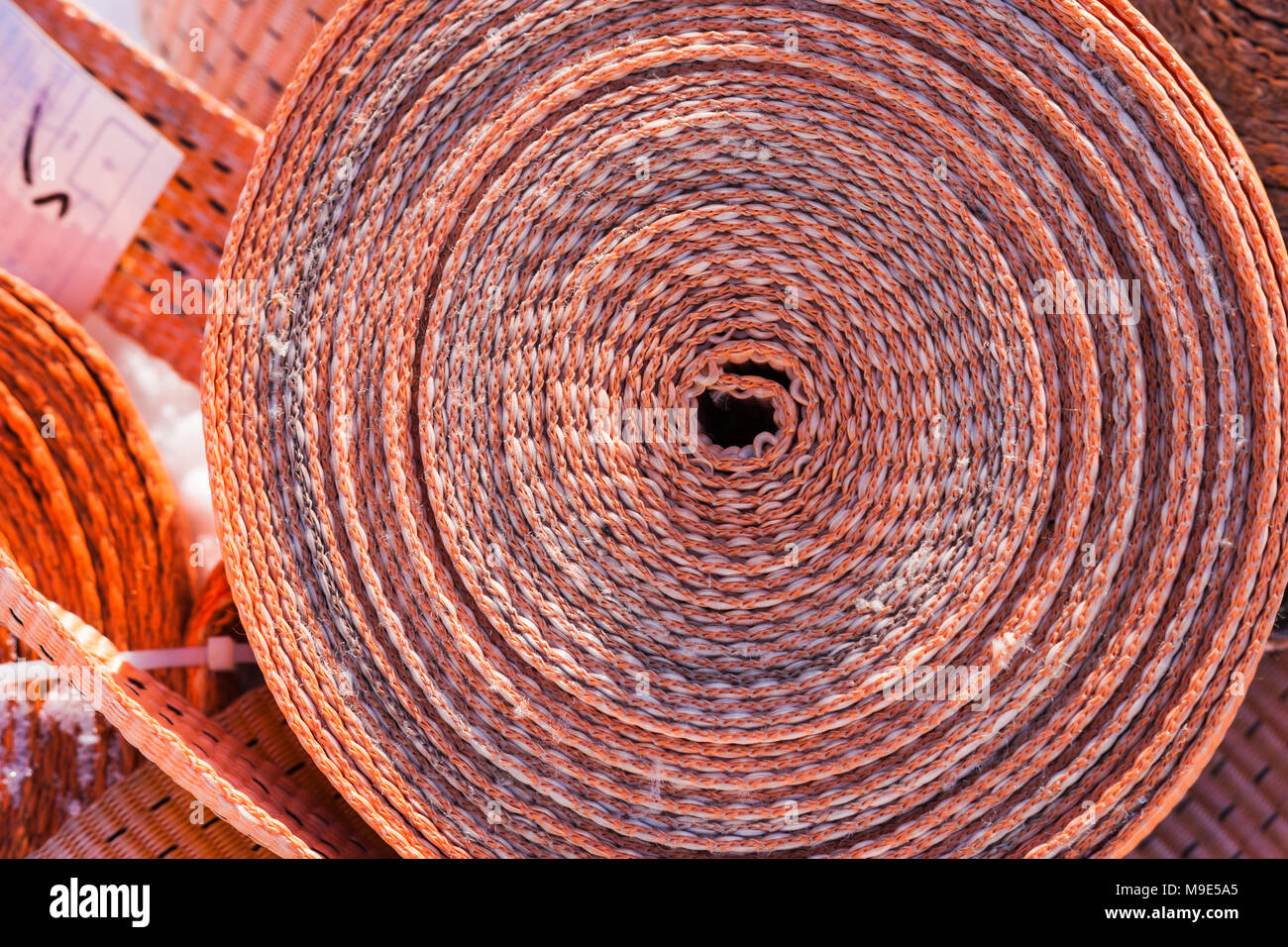 Bunch of orange plastic construction tape in snow. Decorative pattern ...