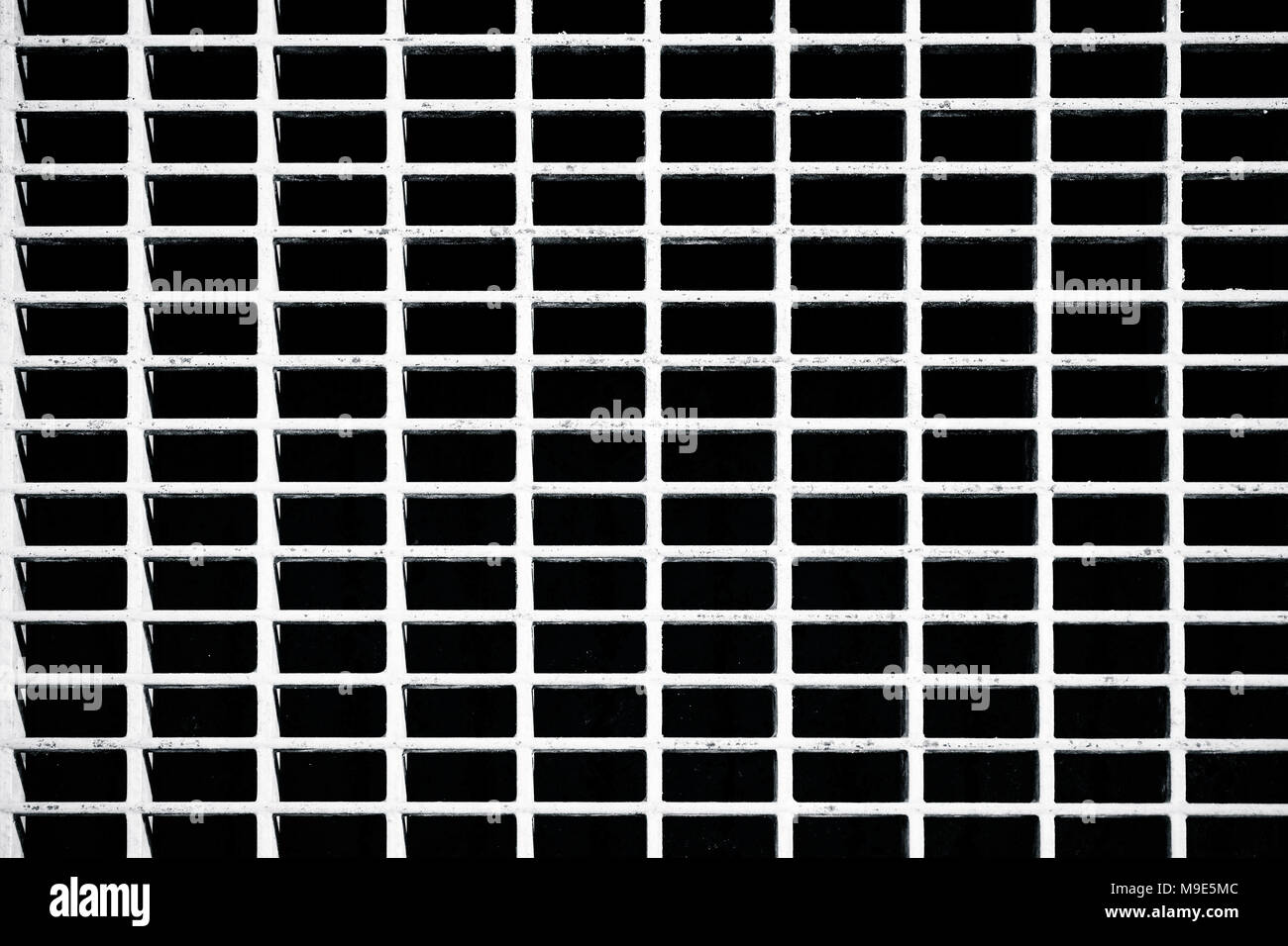 White metal grid of rectangle shape, black background. Abstract ...