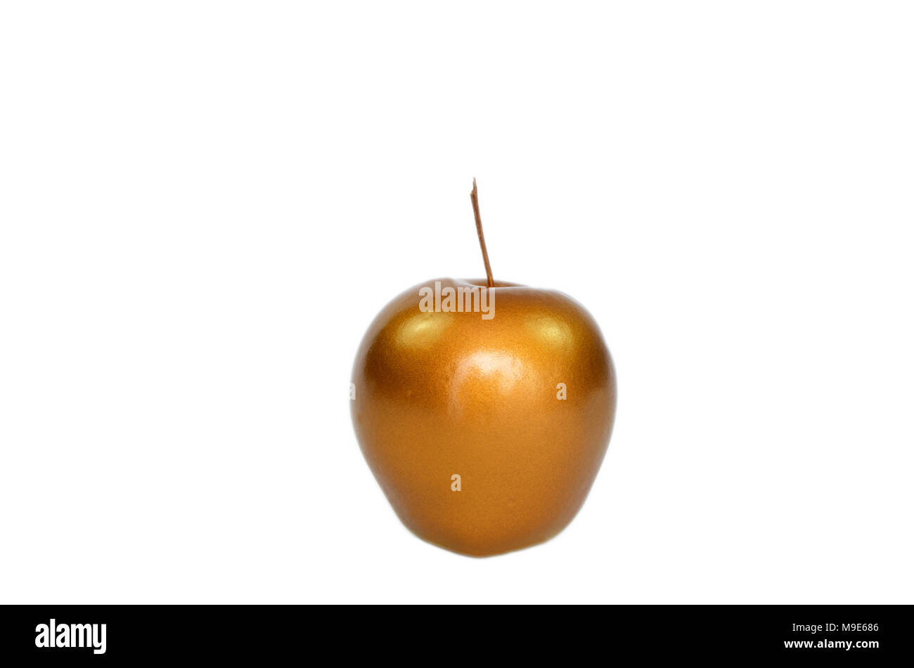 Golden apple with an isolated white background Stock Photo - Alamy