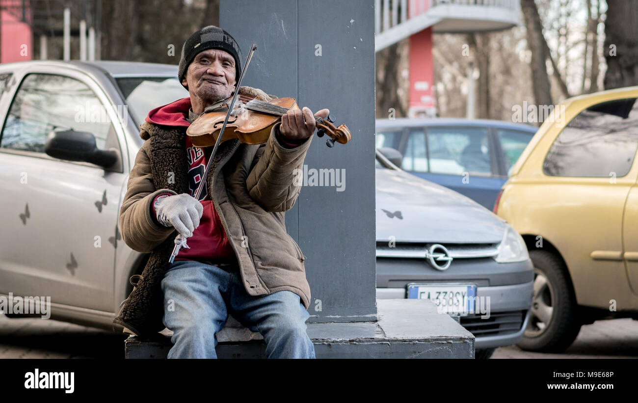 CHISINAU, MOLDOVA - 28 DECEMBER, 2016: A man playing on the violin in ...