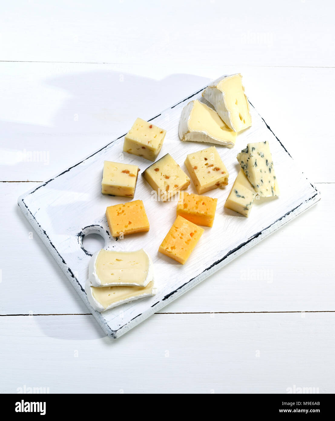 small pieces of brie cheese, roquefort, camembert, cheddar and cheese ...