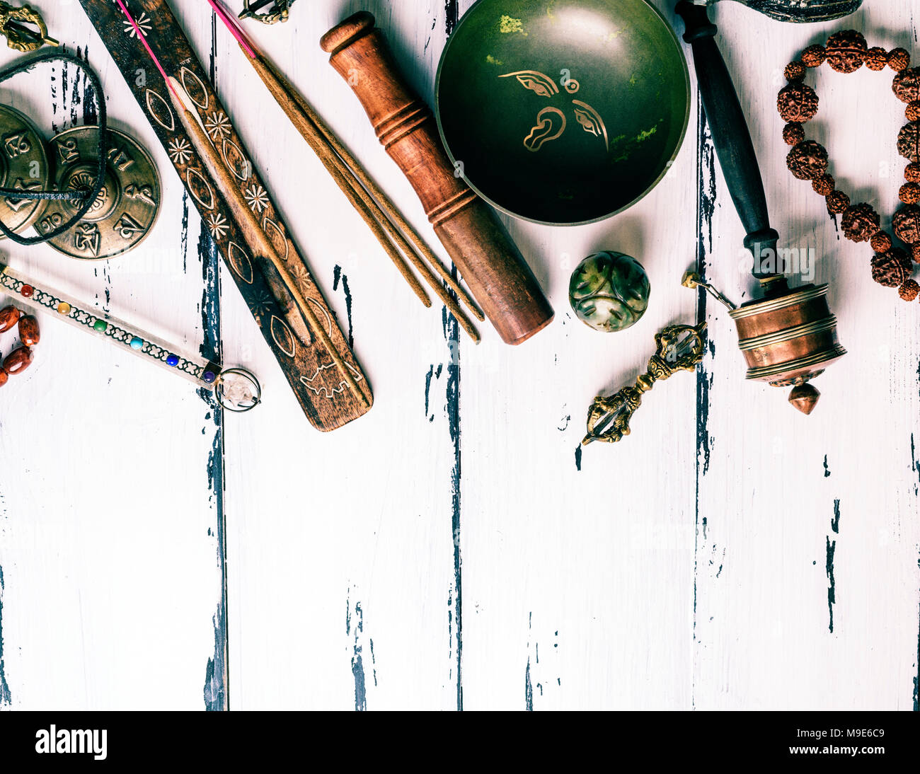 Copper singing bowl, prayer beads, prayer drum, stone balls and other ...