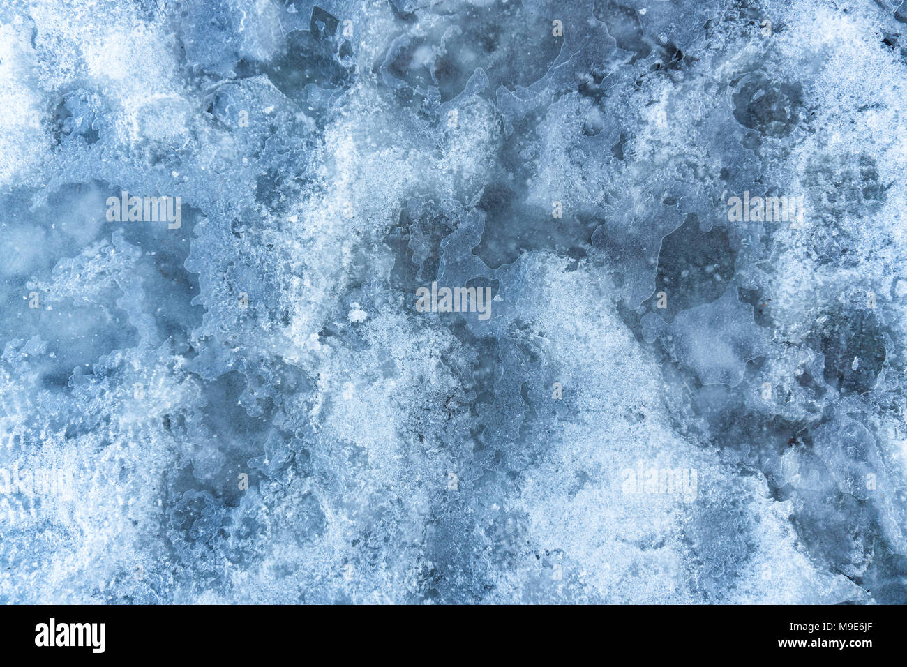 texture of ice crust in winter on the lake Stock Photo - Alamy