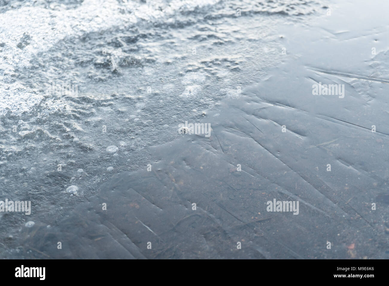 texture of ice crust in winter on the lake Stock Photo - Alamy