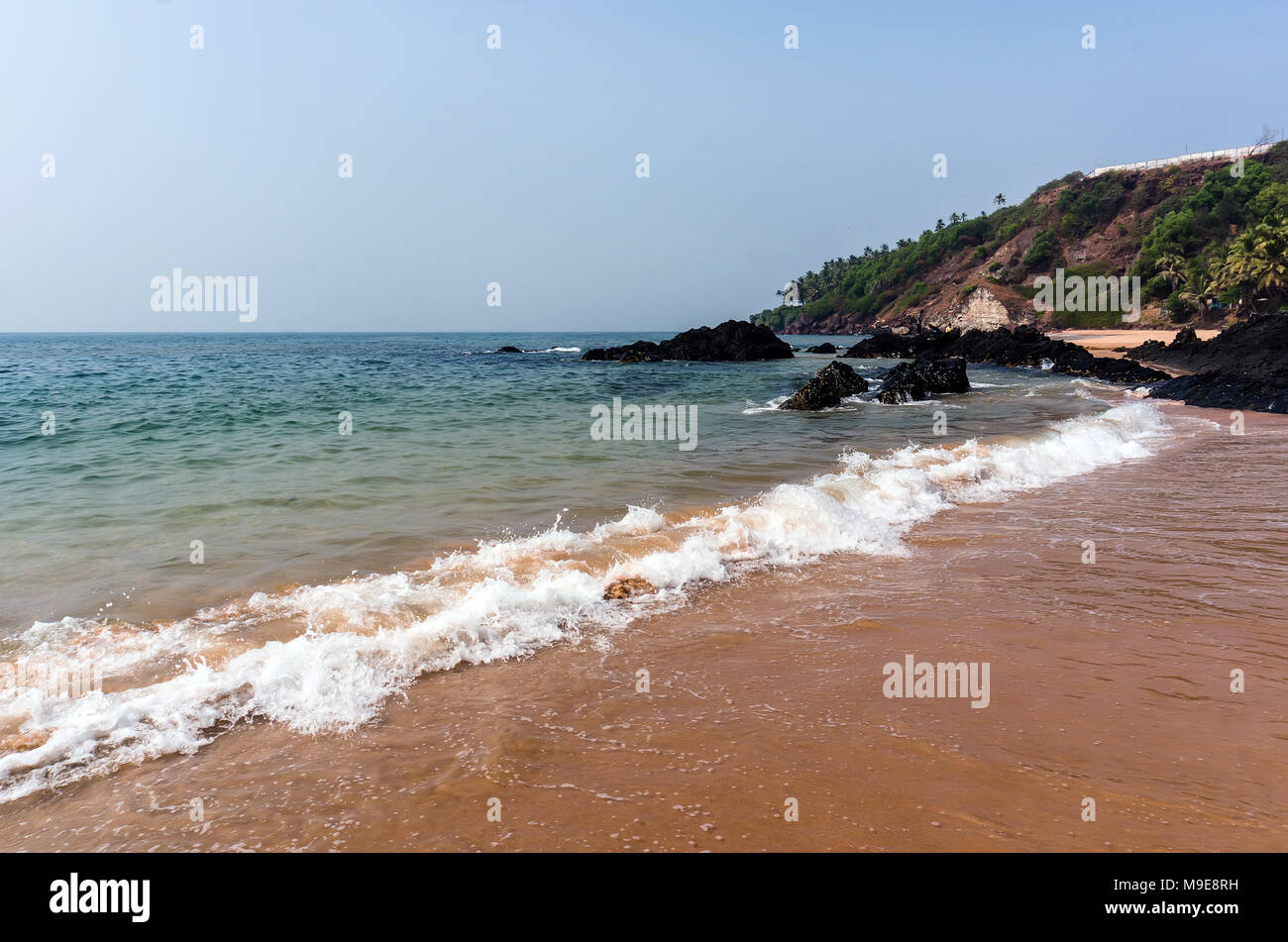 Quiet waves on the Vagator beach Vasco da Gamma. Goa India Stock Photo ...