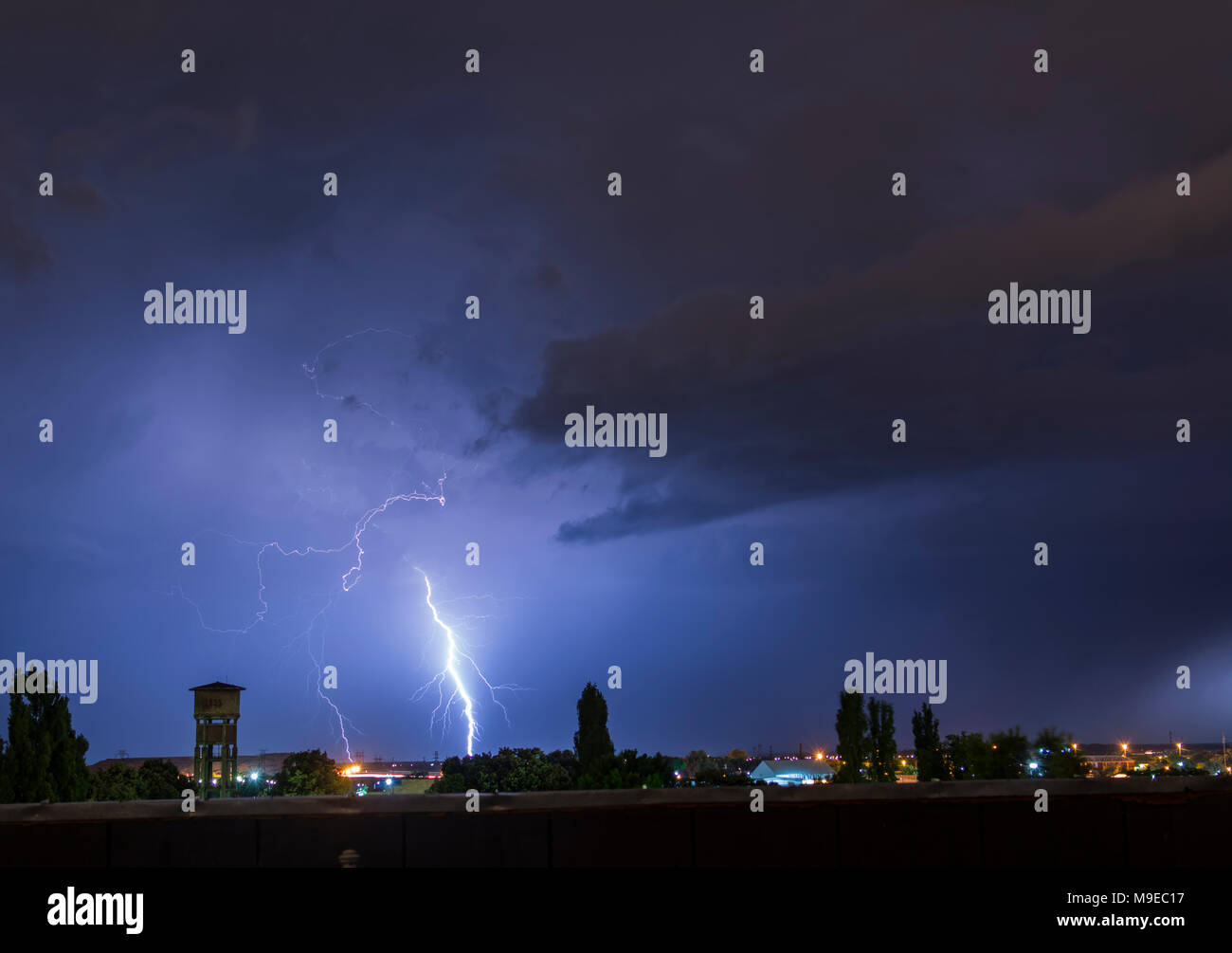 Lightning flash over a city, Thunderstorm , electricity blast storm ...