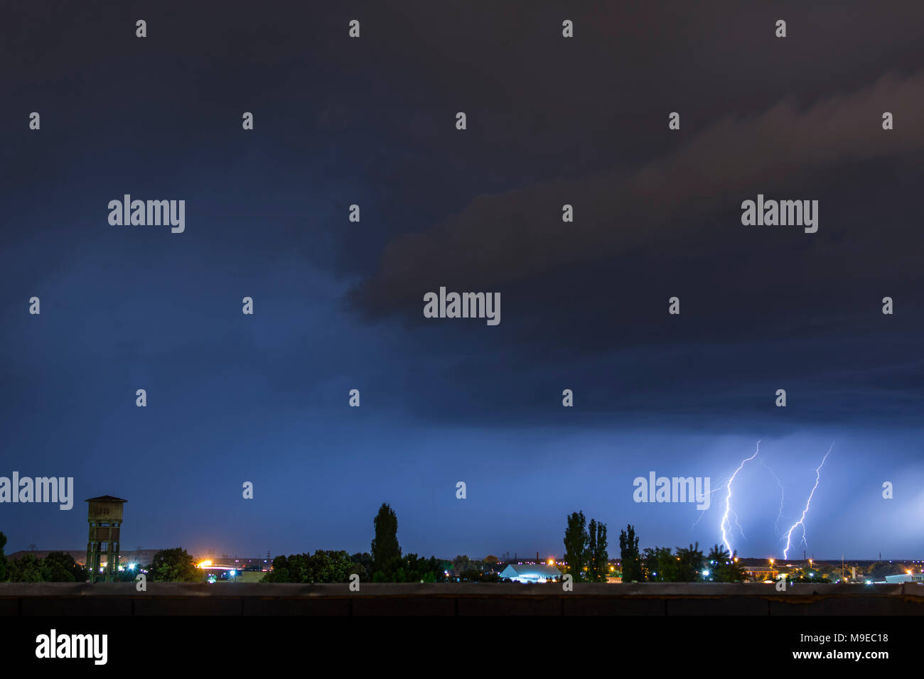 Lightning flash over a city, Thunderstorm , electricity blast storm ...