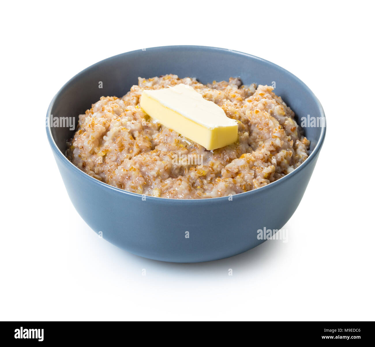 Cooked cereal with butter on white isolated background Stock Photo - Alamy