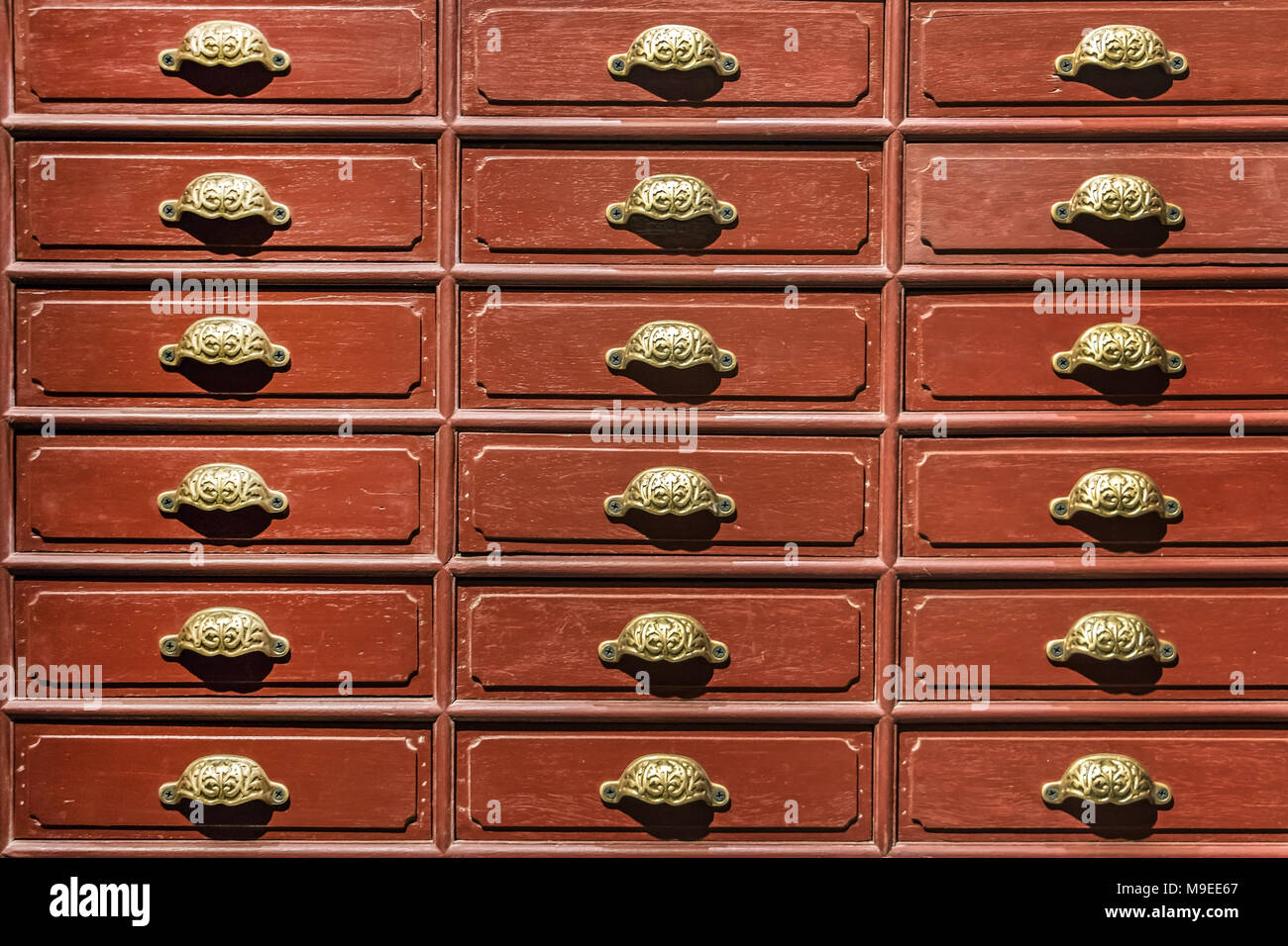 Rows of old classic drawers in obsolete shop from the 19th century ...