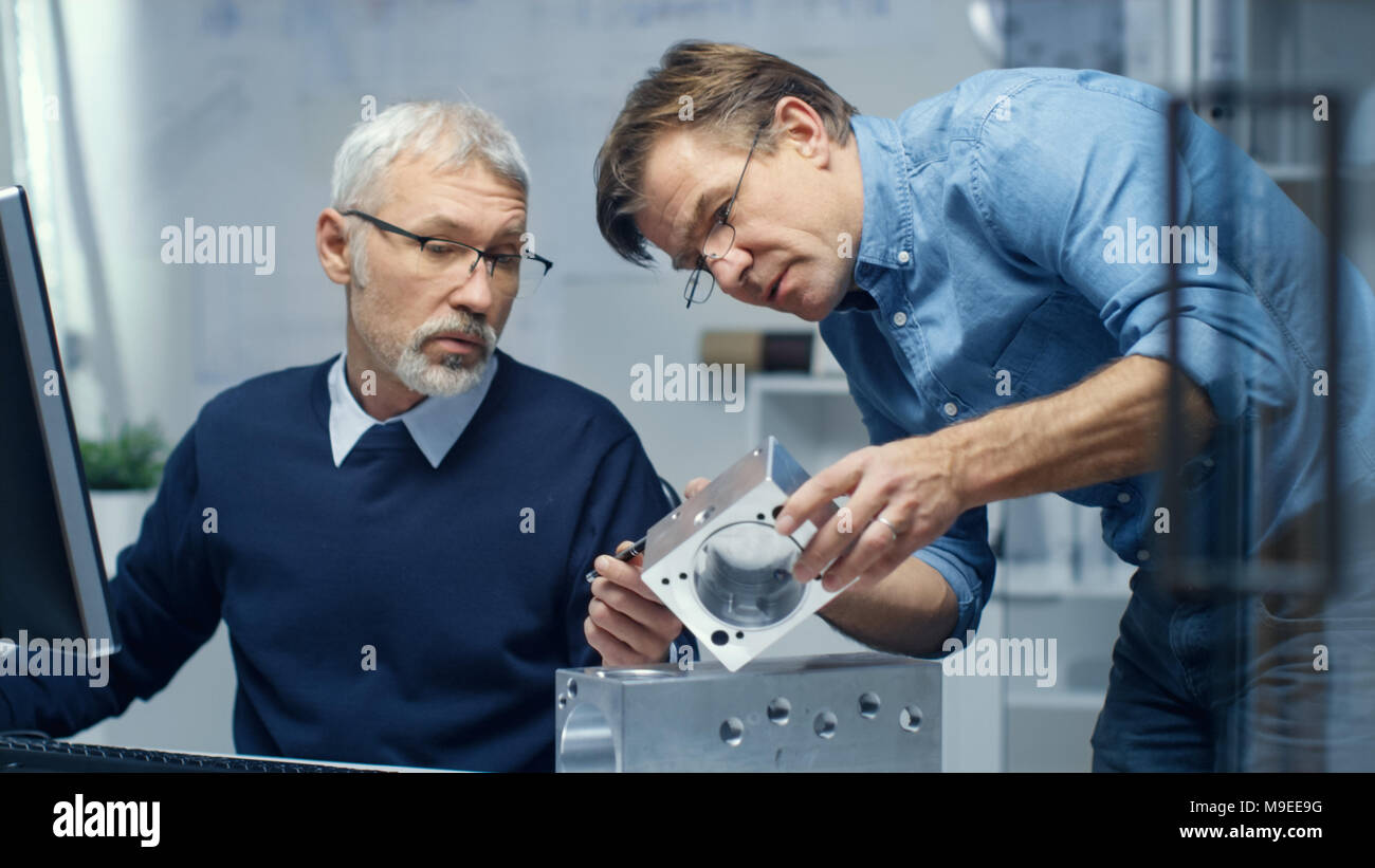 Two Senior Engineers Discuss Important Technical Component. Both are ...