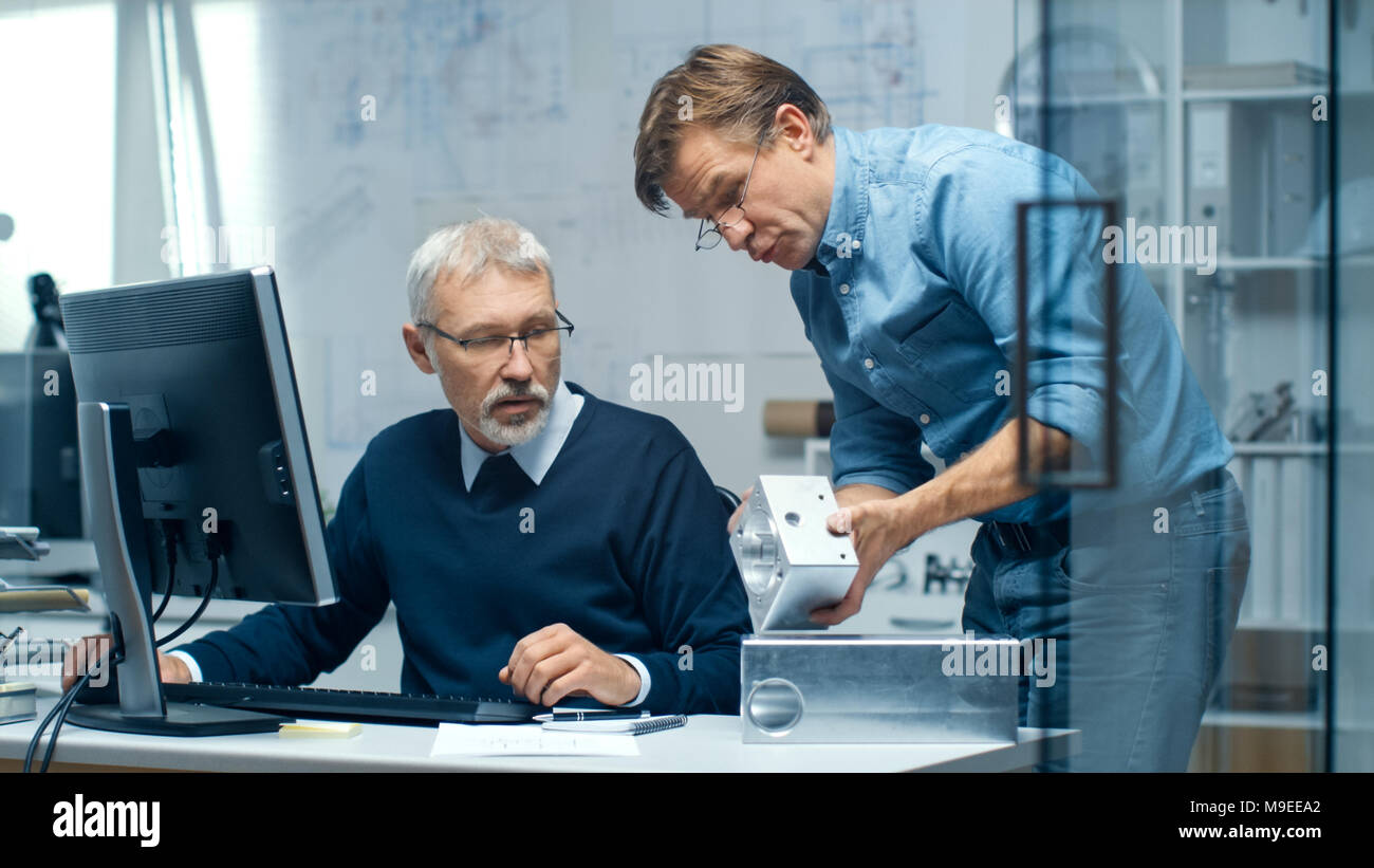 Two Senior Engineers Discuss Important Technical Component. Both are ...