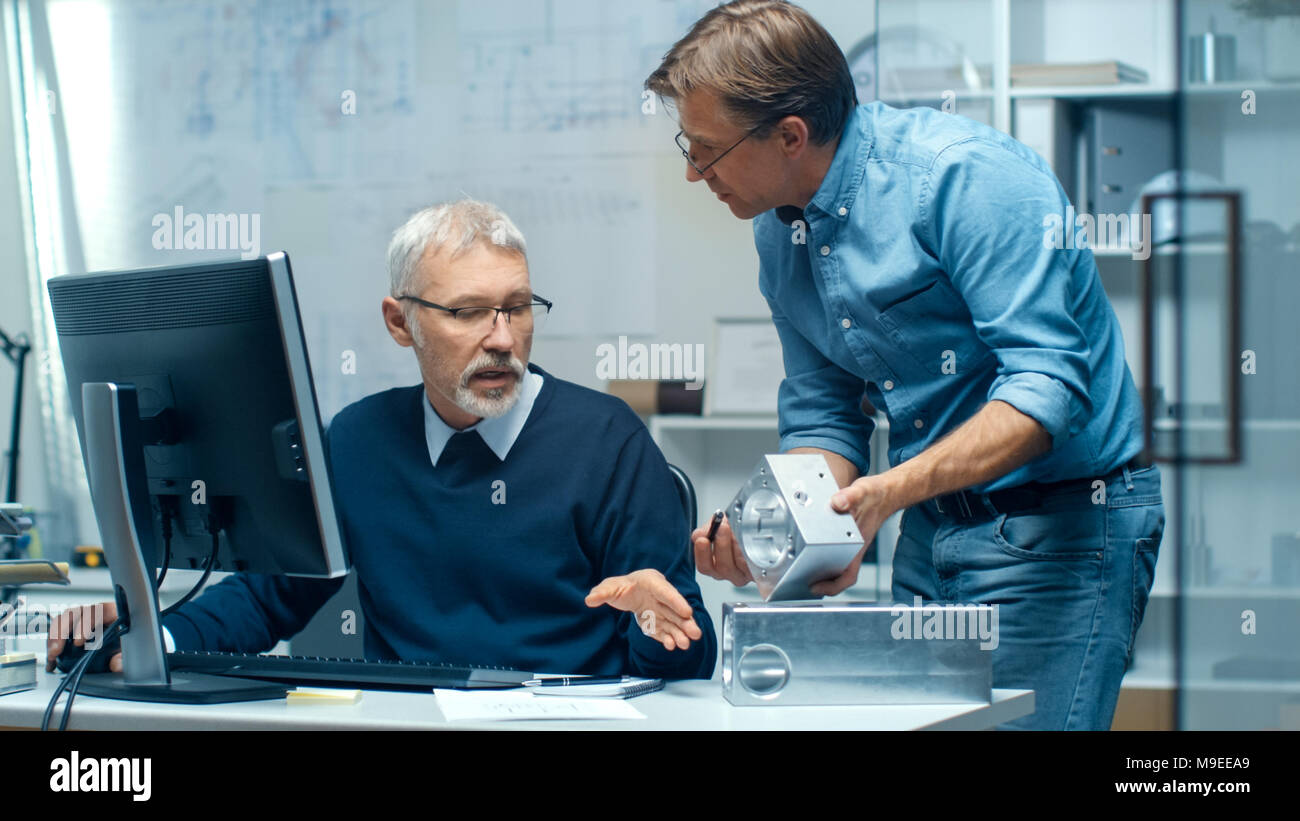 Two Senior Engineers Discuss Important Technical Component. Both are ...