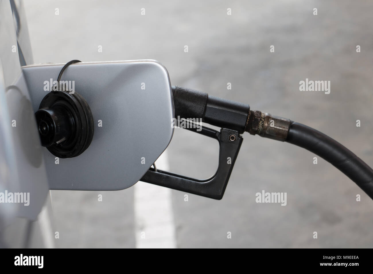 To fill the car with fuel, close up. Car refueling on a petrol station ...
