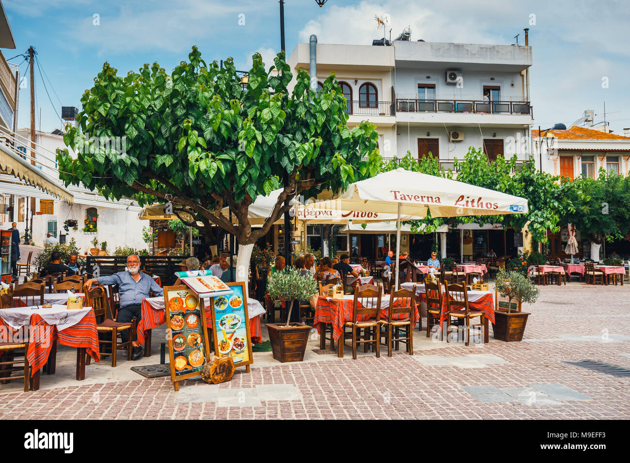 Mochos, Crete - June 13, 2017: Tavern Lithos on the main square in the ...
