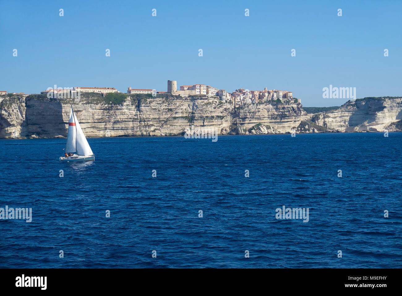 Sailing boat at Bonifacio, old historic harbour town built on a ...