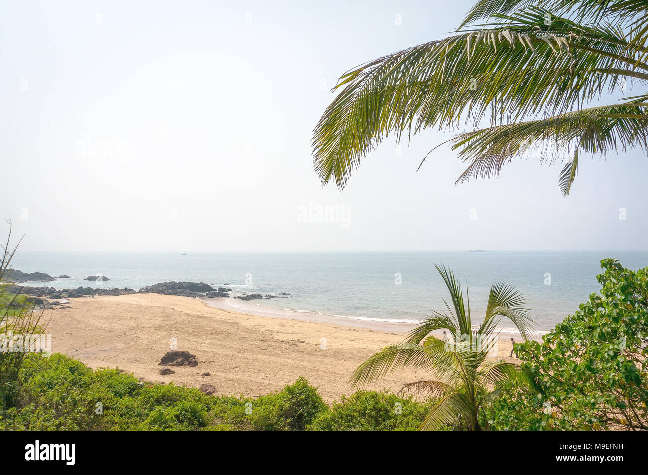Beautiful sea coast in Goa. India. Beach with yellow sand at the blue ...