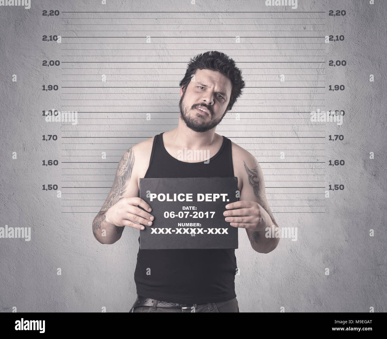 Caught gangster in jail with table on his hand Stock Photo - Alamy