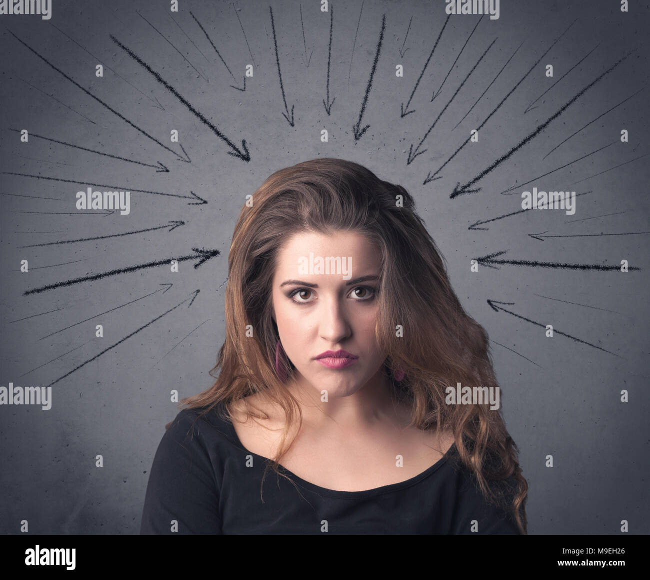 A teenage student girl under pressure while making happy face ...