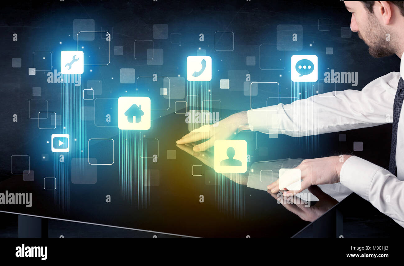 Modern smart table with high tech icons on its interface screen concept ...