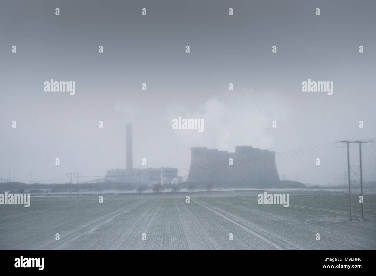 Snowy fields surround a grim looking Eggborough Power Station on a drab ...