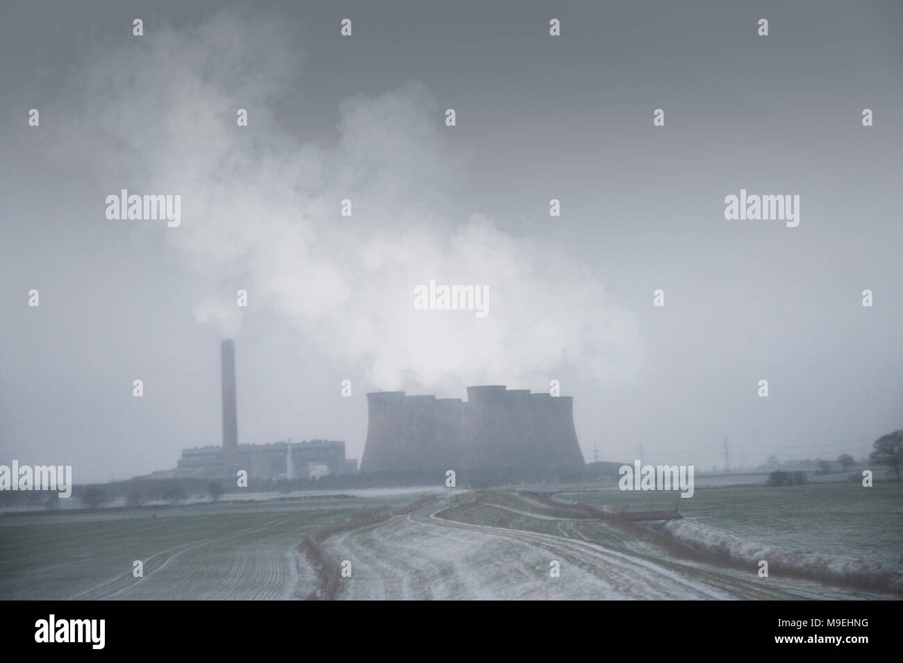 Snowy fields surround a grim looking Eggborough Power Station on a drab ...