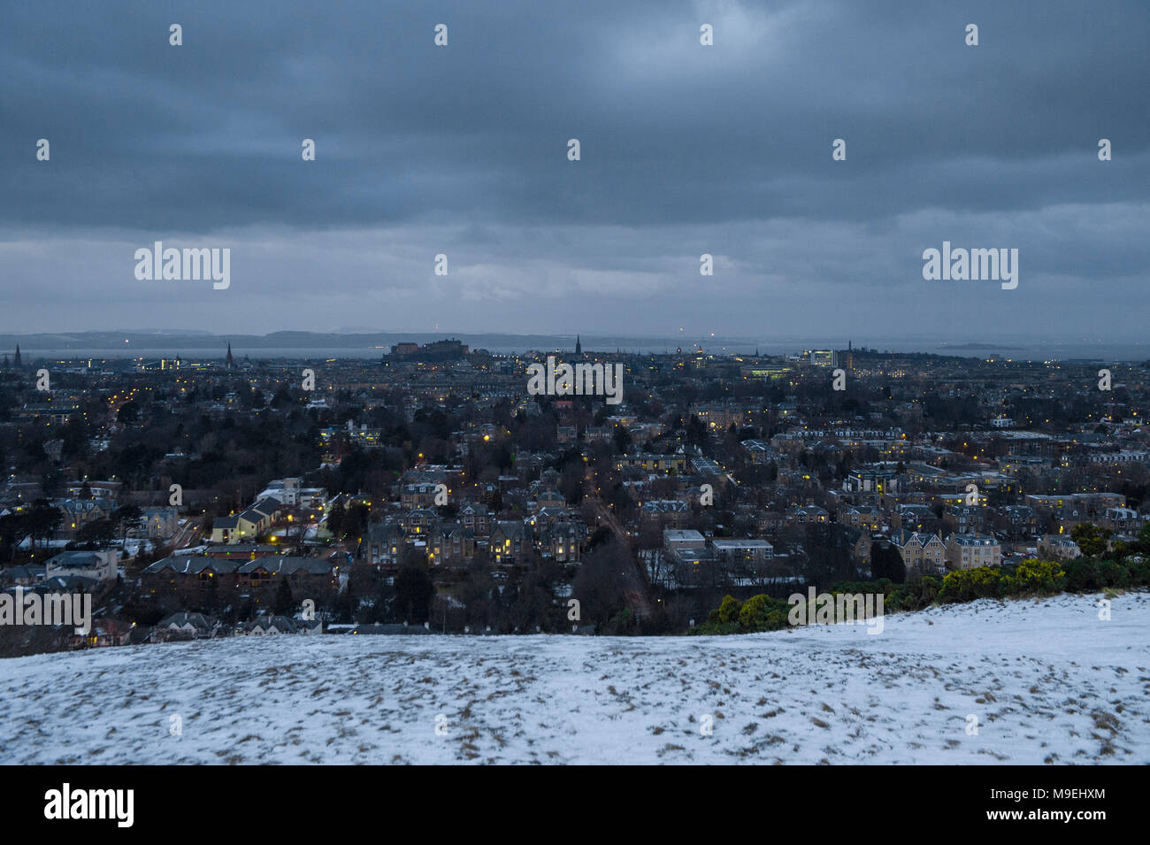 A view from high above Edinburgh in half light with Edinburgh Castle ...