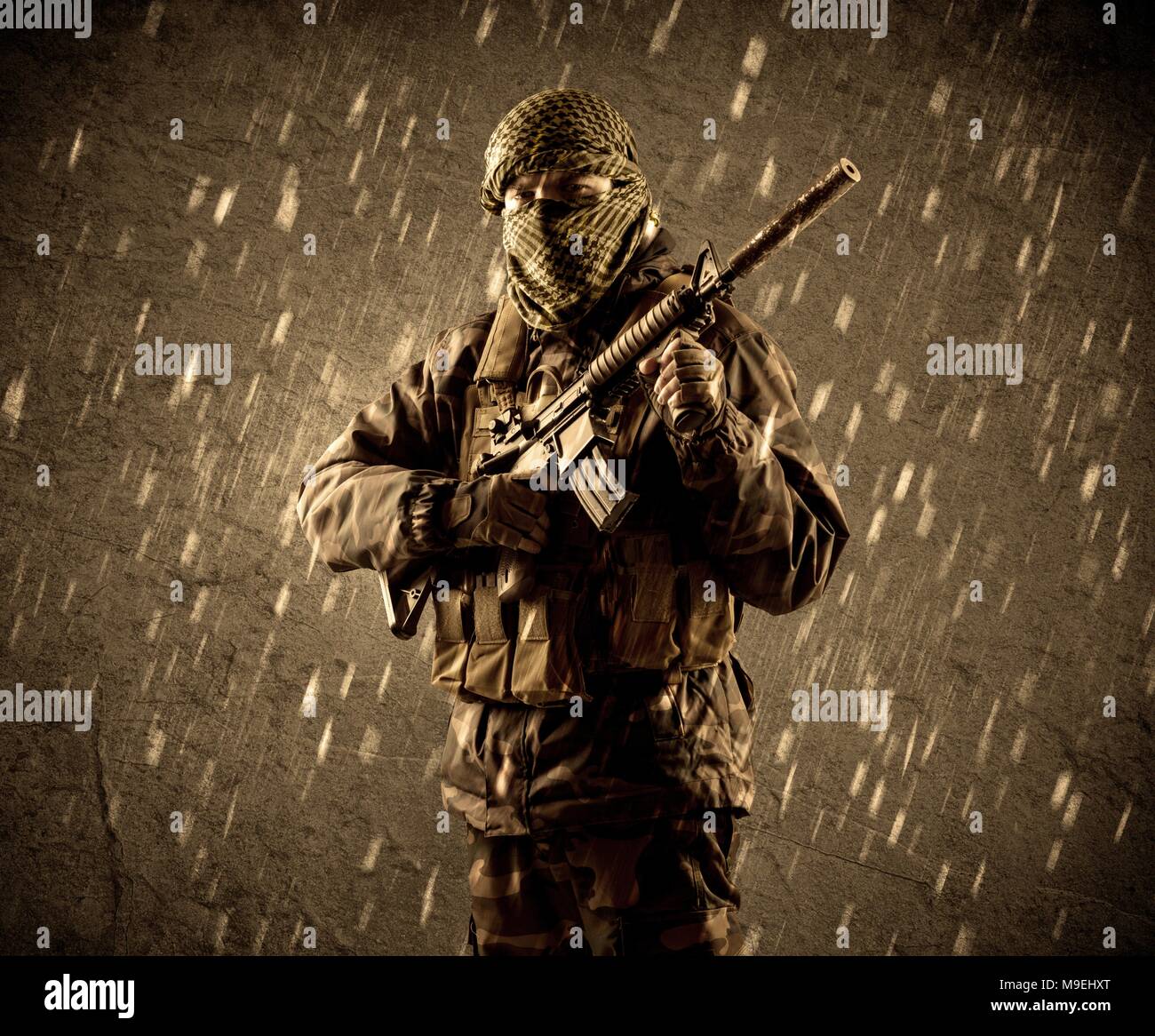 Portrait of dangerous heavily armed terrorist soldier with mask on ...