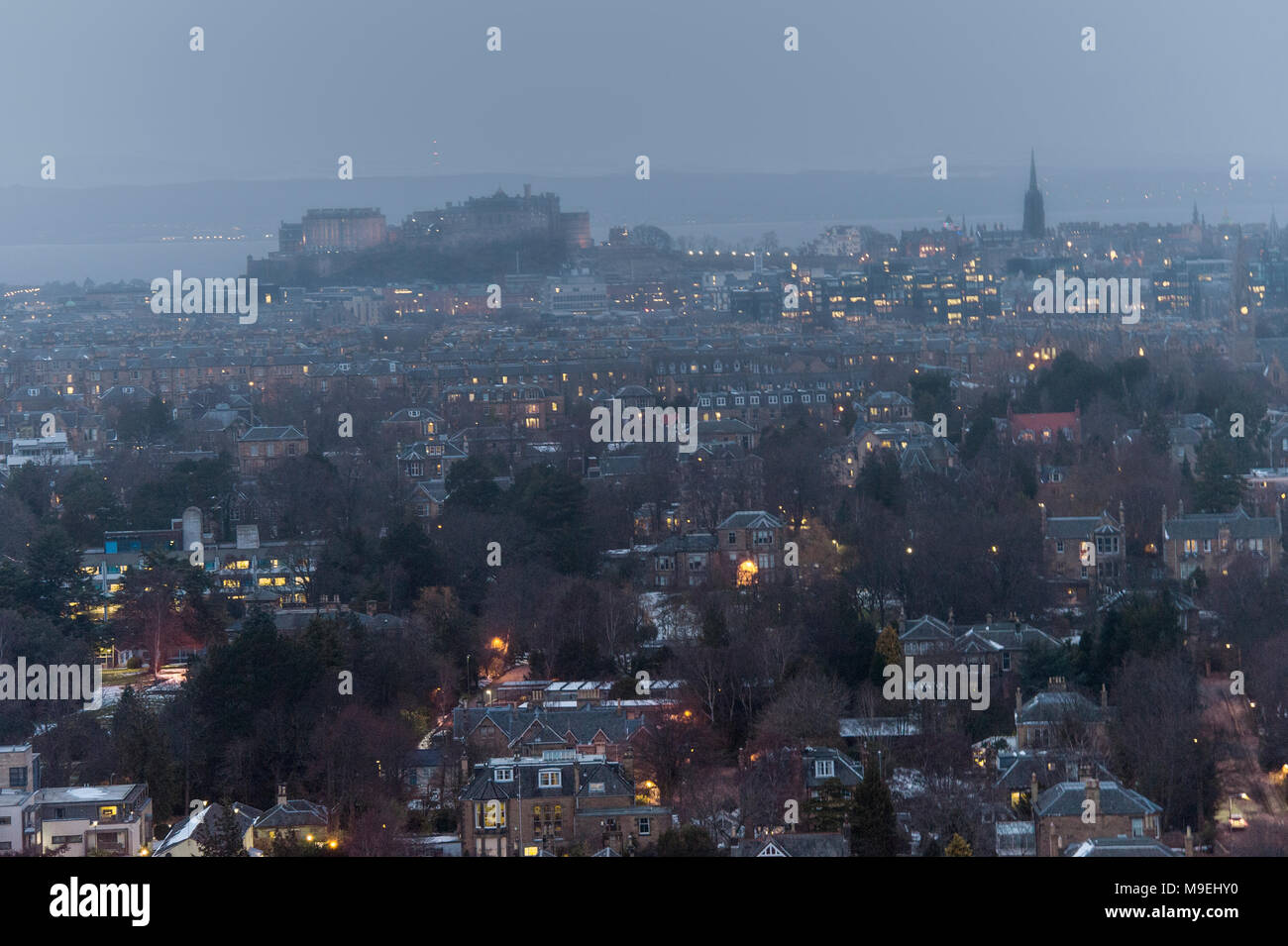 A view from high above Edinburgh in half light with Edinburgh Castle ...
