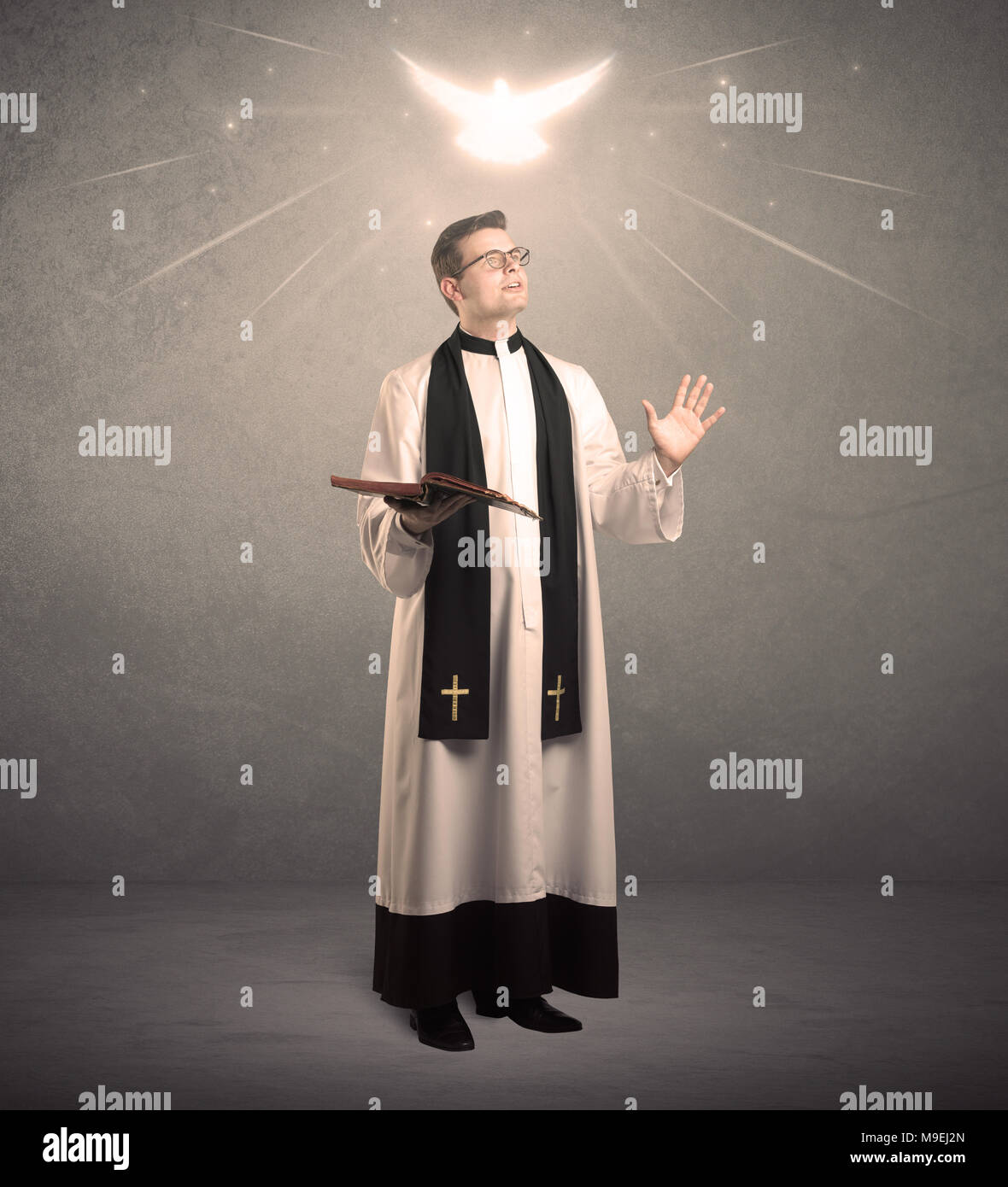A holy priest reading a prayer from the holy bible with illustrated ...