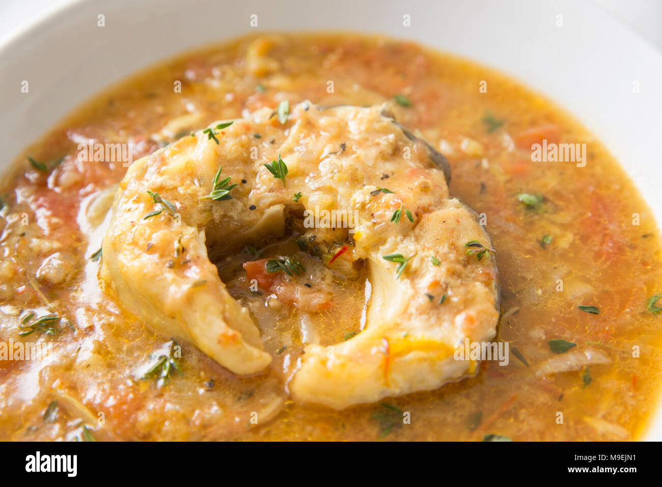 A simple fish stew comprising conger eel cutlets simmered in fried ...