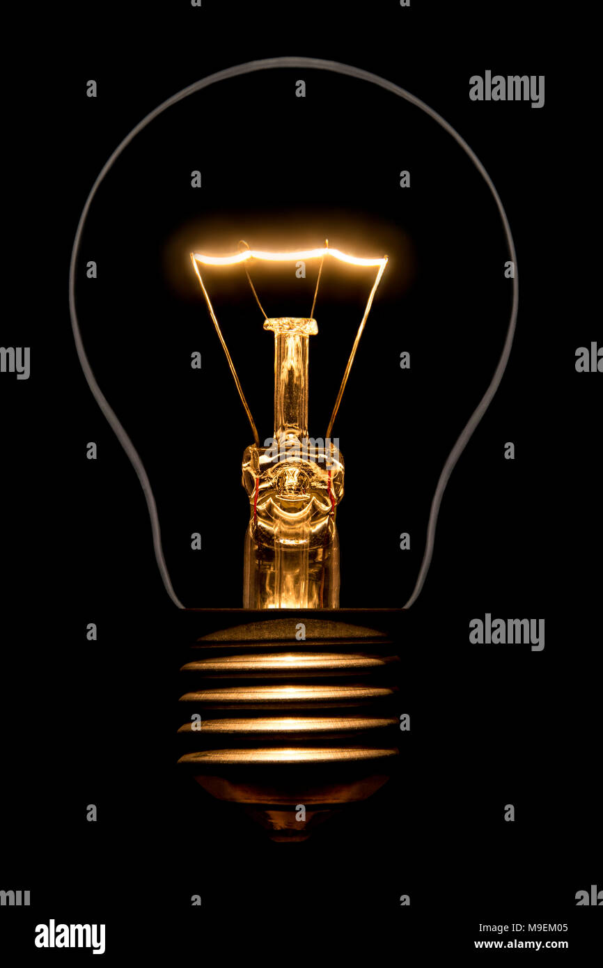 Photo of silhouette of incandescent filament bulbs on a black ...