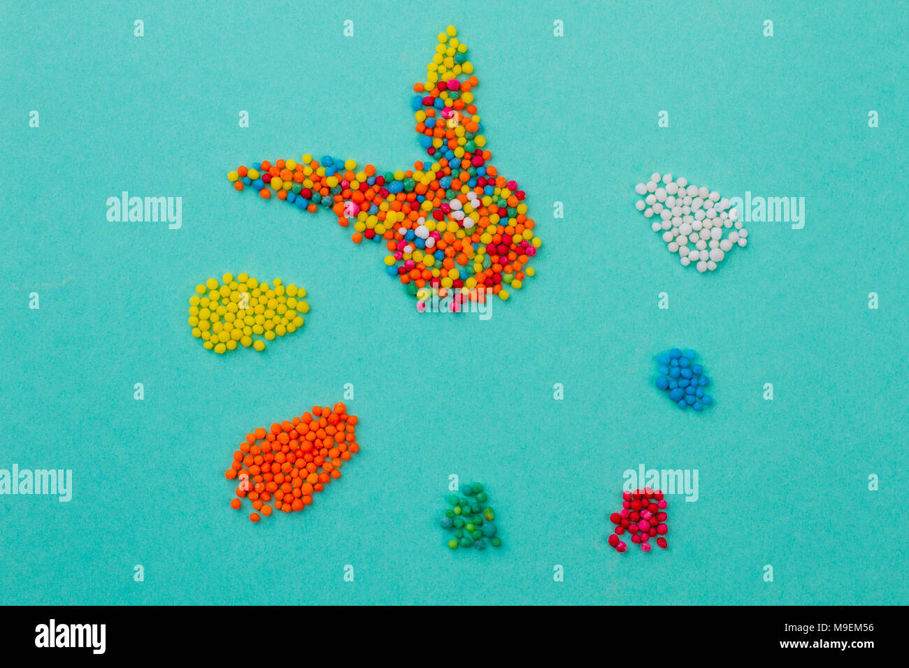 Rabbit made from colorful sweets. Sprinkle dots forming rabbit and ...
