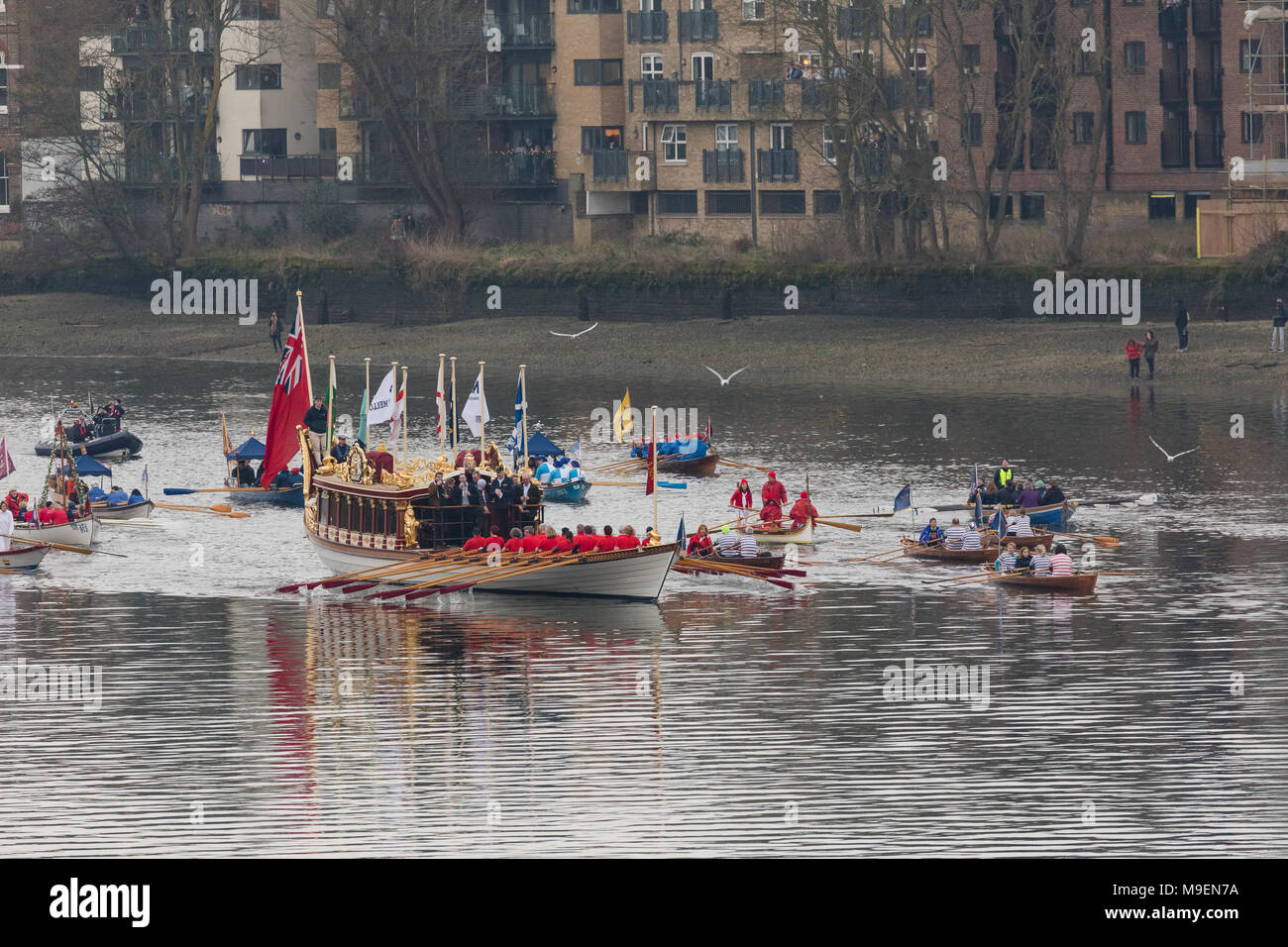 London, UK. 24th March 2018. Gloriana, the Queen's row barge, escorted ...