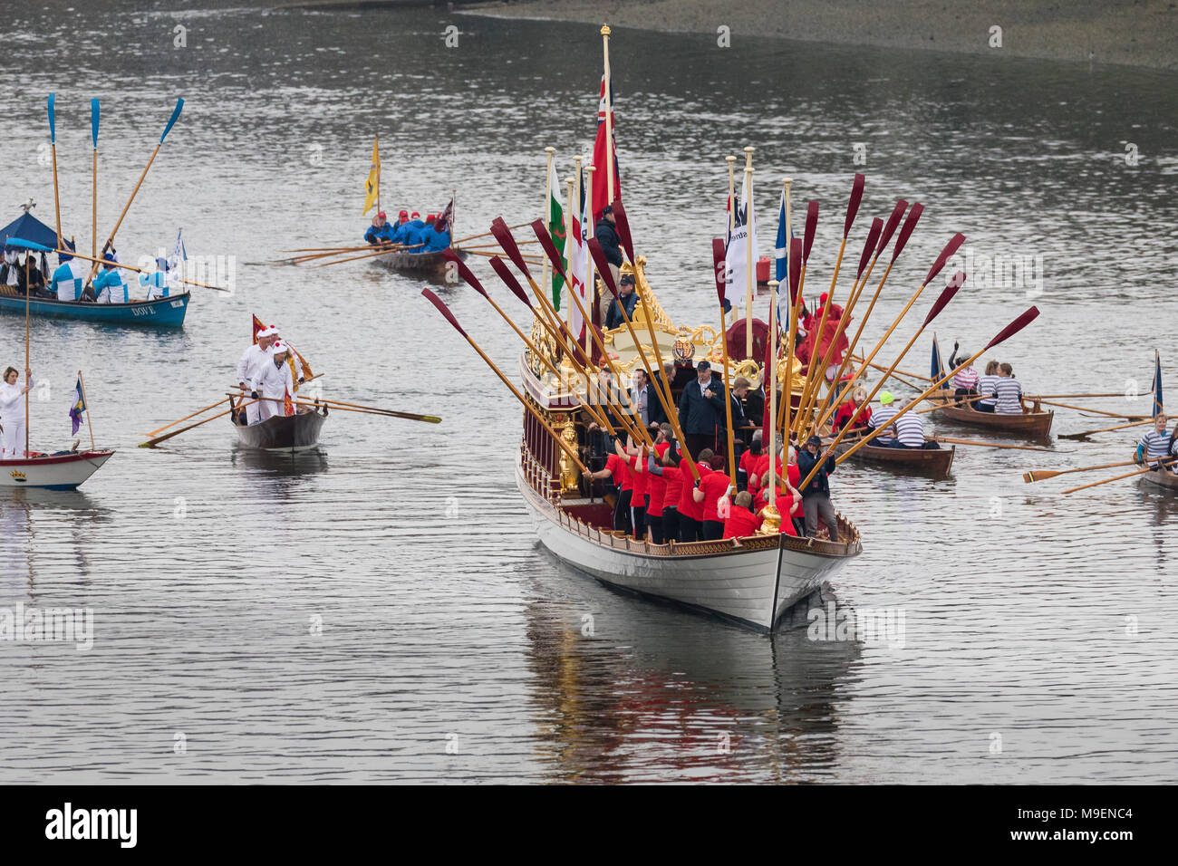 London, UK. 24th March 2018. Gloriana, the Queen's row barge, escorted ...