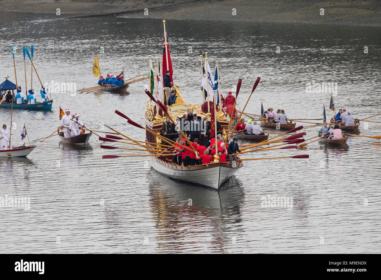 London, UK. 24th March 2018. Gloriana, the Queen's row barge, escorted ...