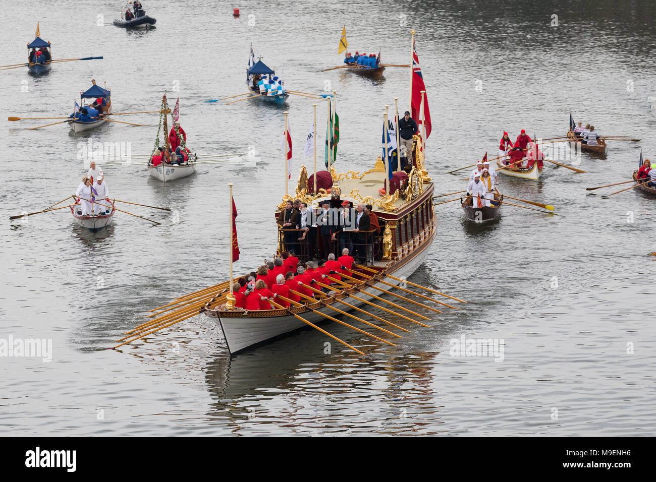 London, UK. 24th March 2018. Gloriana, the Queen's row barge, escorted ...