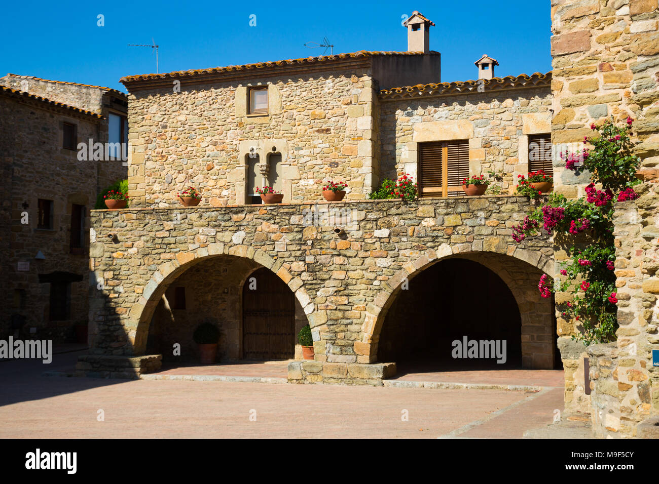 View of medieval street in Catalan village of Monells, Spain Stock ...