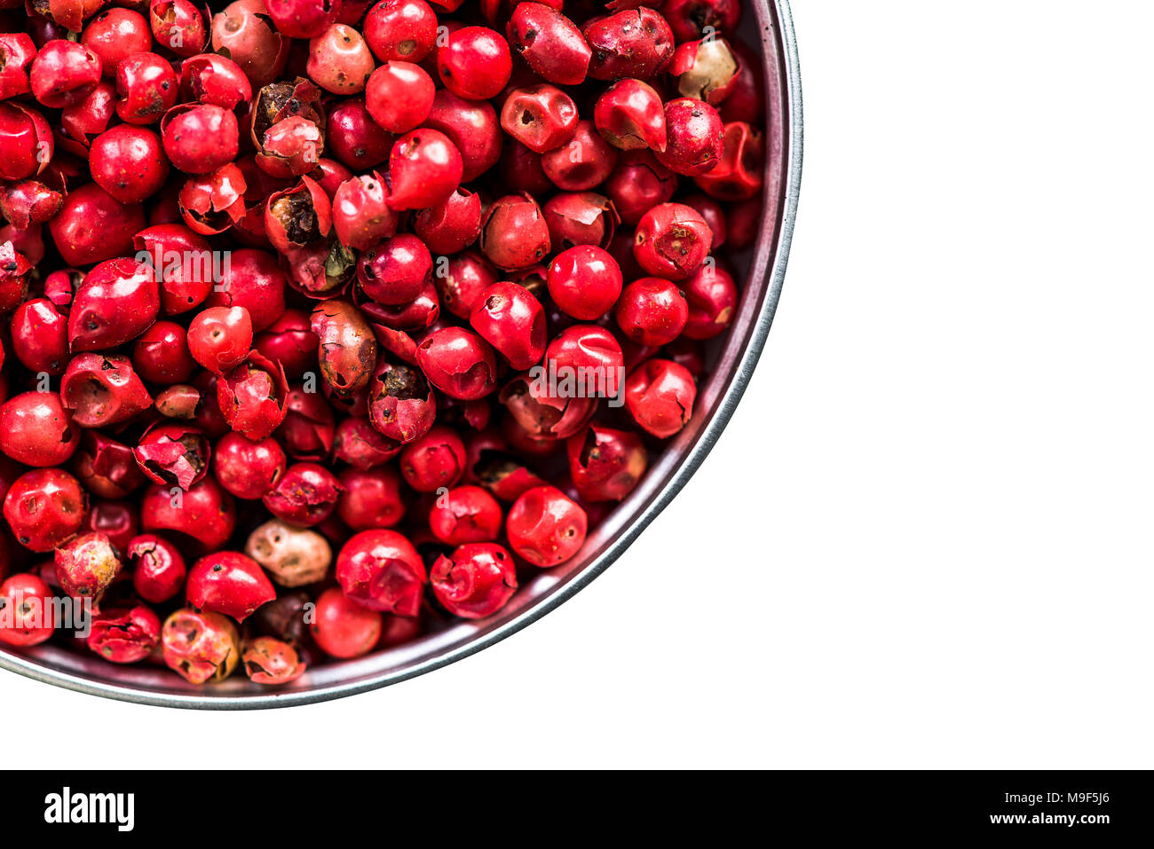 Red pepper seeds in pot isolated on white Stock Photo - Alamy