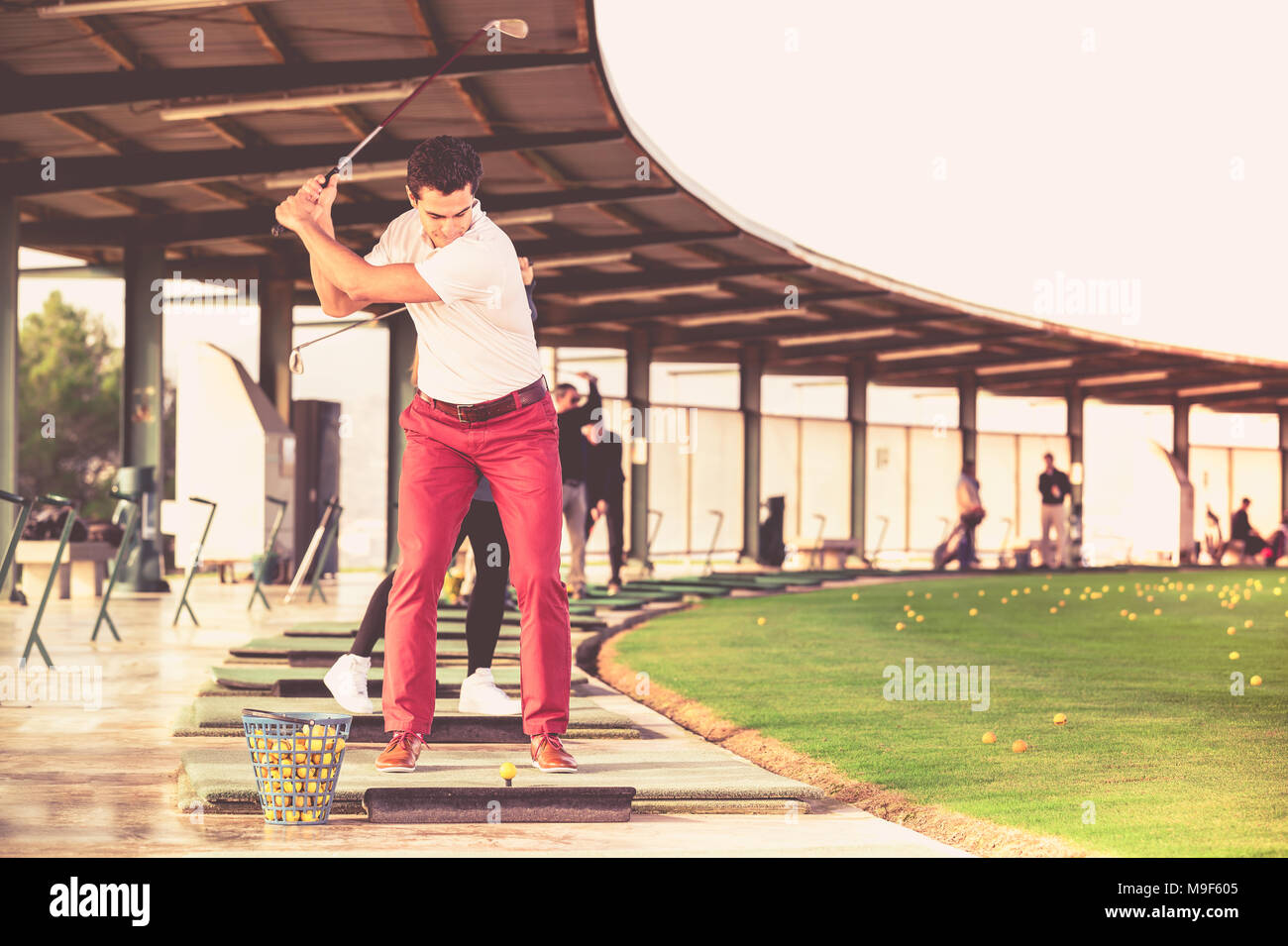 Glad male golfer is ready for play at golf course Stock Photo - Alamy
