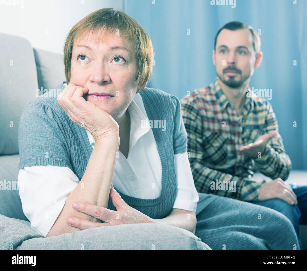 Aged mother arguing with her adult son at home Stock Photo - Alamy