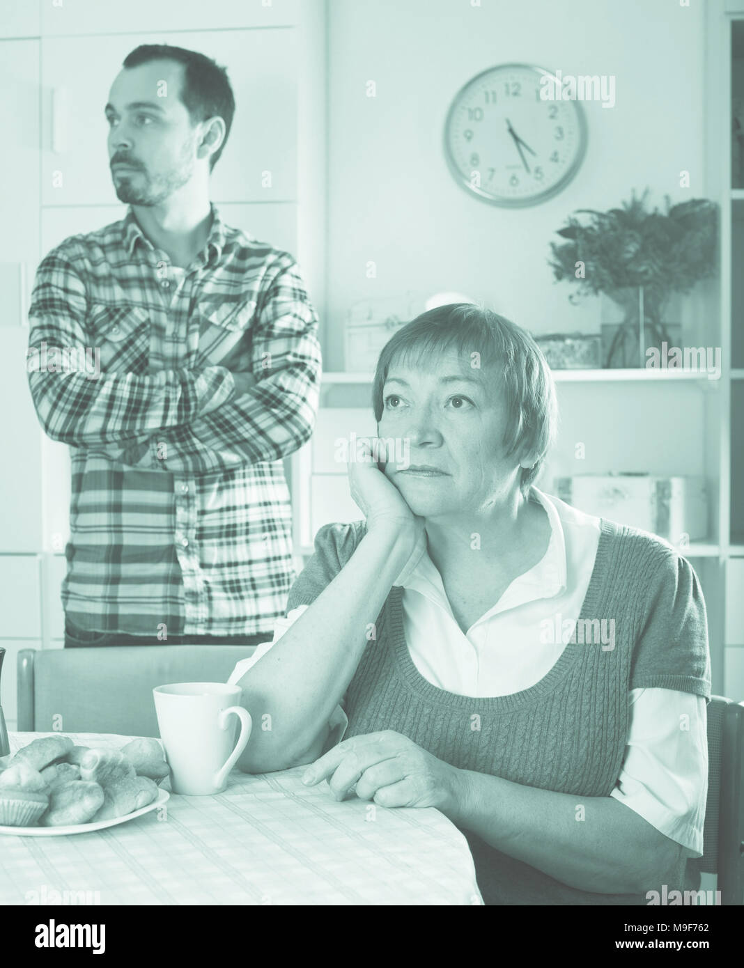 Aged mother arguing with her adult son at home Stock Photo - Alamy