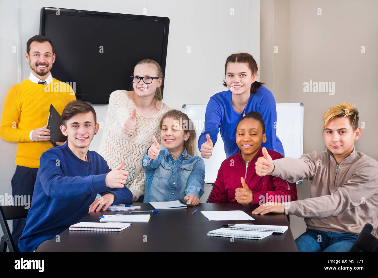 Fellow students expressing their enjoyment of studying at school Stock ...